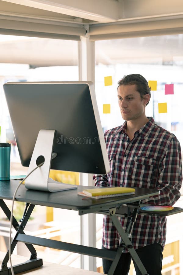 Male Graphic Designer Working on Computer at Desk Stock Image - Image ...