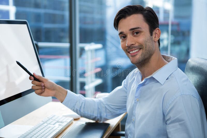 Male Graphic Designer Working at Desk Stock Photo - Image of occupation ...