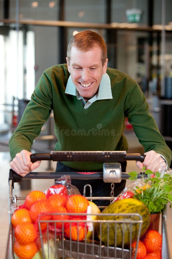 Helpful Grocery Store Clerk Stock Image - Image of buying, leisure ...