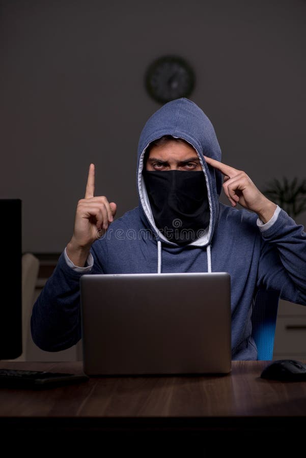 Male Hacker Hacking Security Firewall Late in Office Stock Photo ...