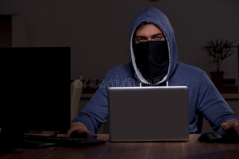Male Hacker Hacking Security Firewall Late in Office Stock Photo ...