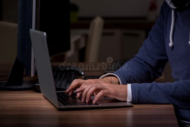 Male Hacker Hacking Security Firewall Late in Office Stock Photo ...