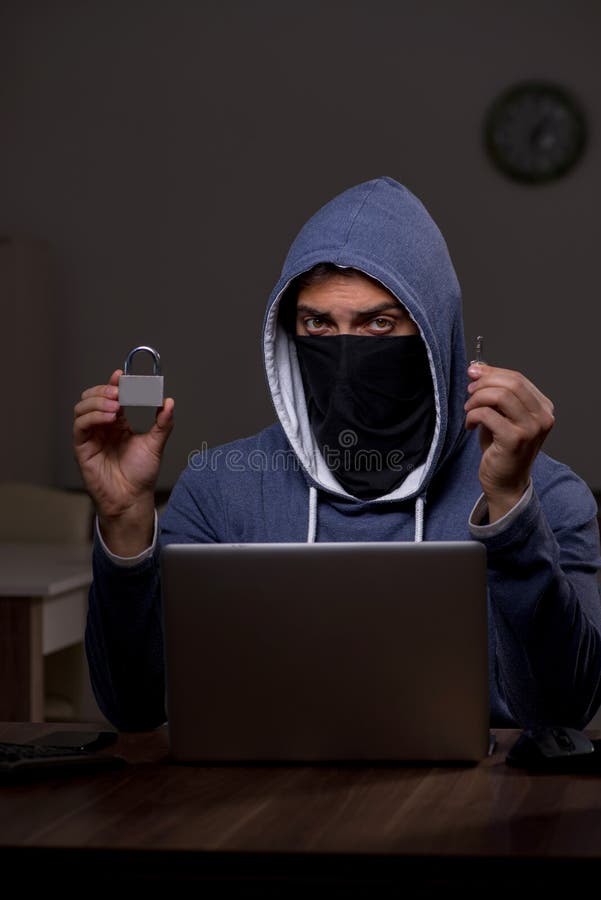 Male Hacker Hacking Security Firewall Late in Office Stock Photo ...