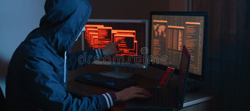 Hacker In The Hood Is Pointing His Finger At The Display Indicating The ...