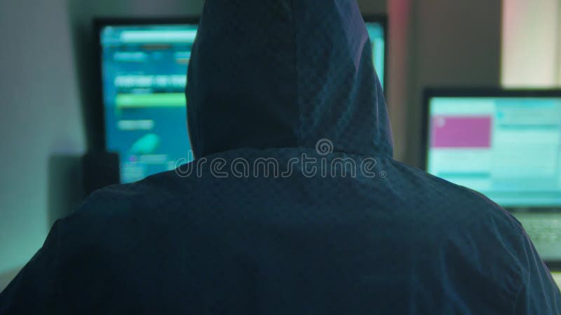 Male Hacker Internet Working on a Computer. Man Hacker in Indoor Hood ...