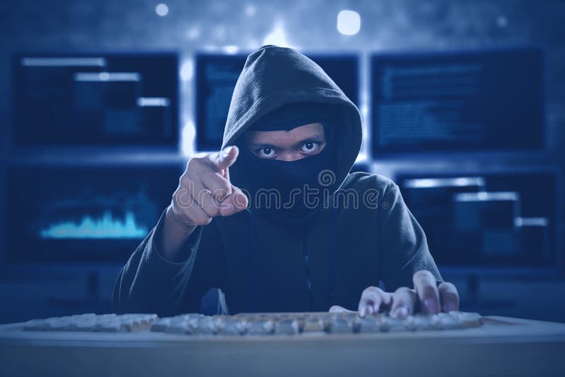 Hacker with Mask Showing a Threatening Gesture Stock Image - Image of ...