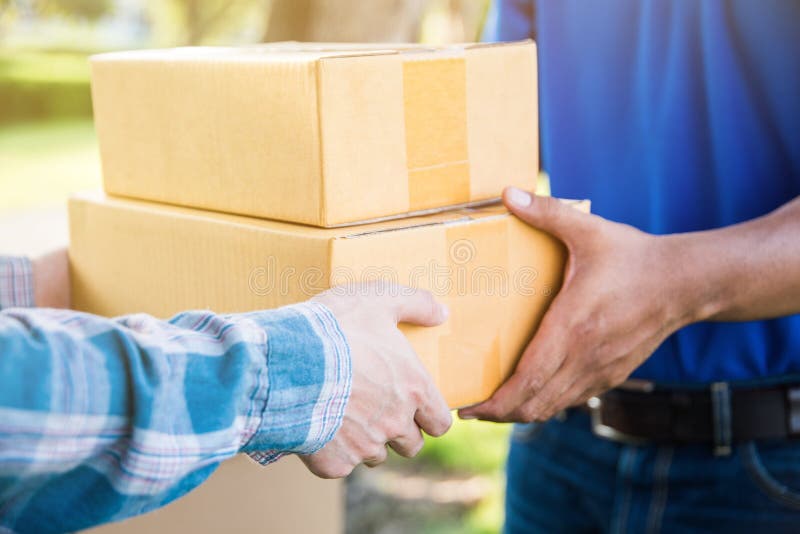 Male Hand Accepting a Delivery of Boxes from Deliveryman. Stock Image ...