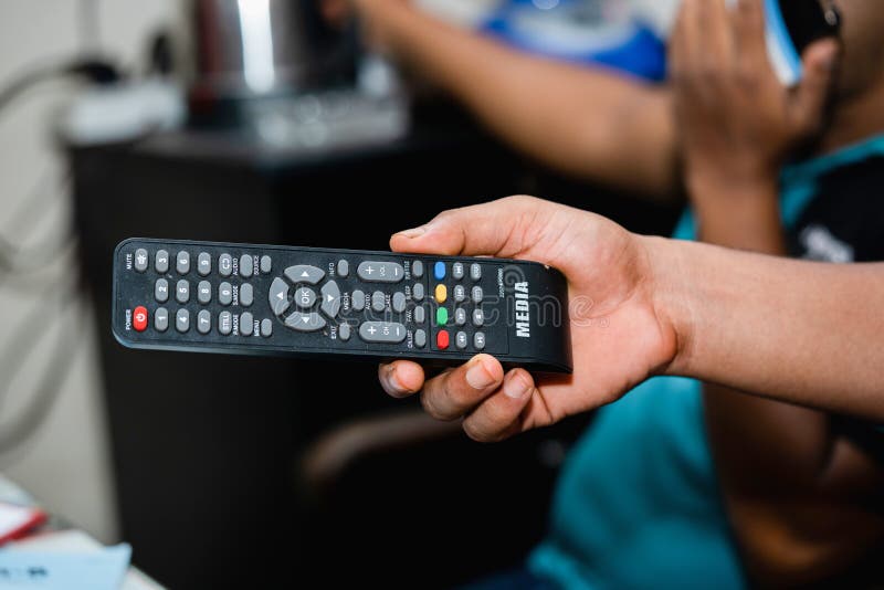 Male Hand Changing Channel with Remote Control Isolated Stock Image ...