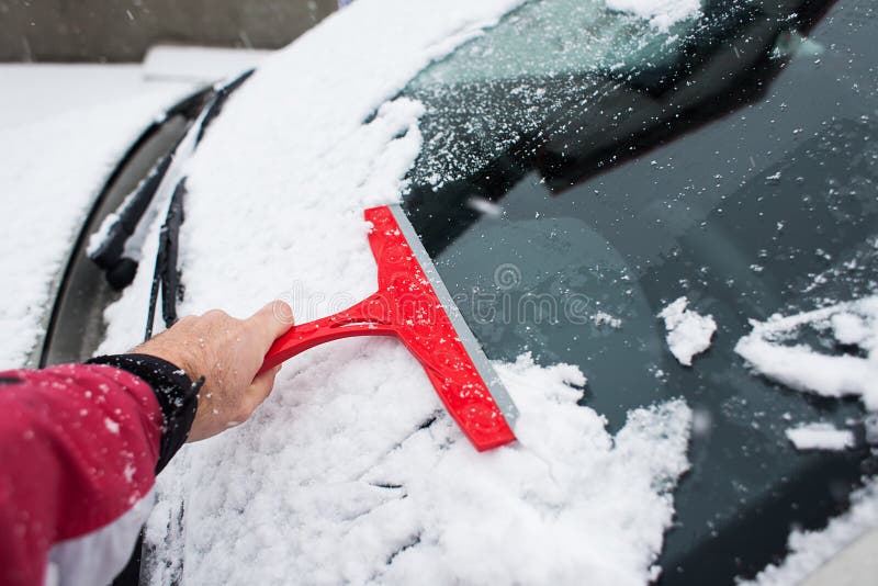 Male Hand Cleaning the Car from the Snow with Red Scrubber Stock Image ...