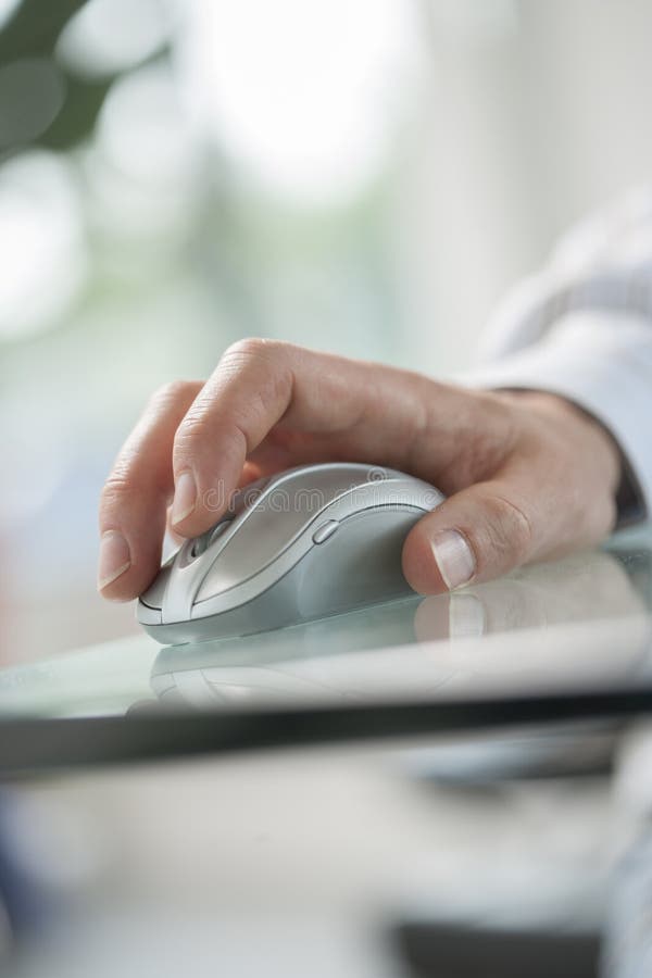 Male Hand Clicking a Cordless Computer Mouse on a Green Table Stock ...