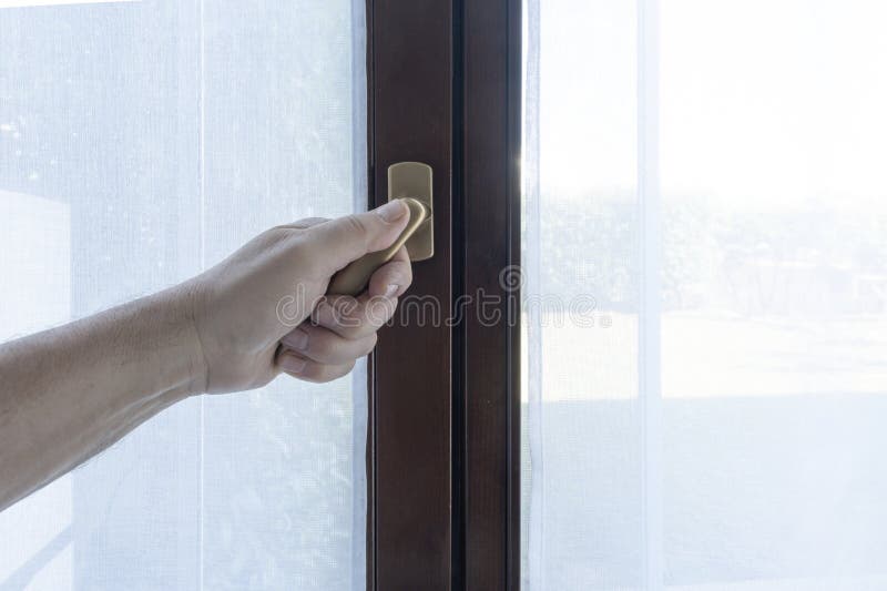 Closing a window stock photo. Image of living, balcony - 335121406