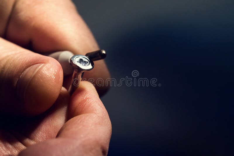 Male Hand Cutting the To Make is Smaller Stock Image - Image of ...