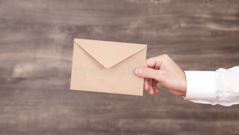 Male Hand Holding Brown Mail Envelope Stock Image - Image of concept ...
