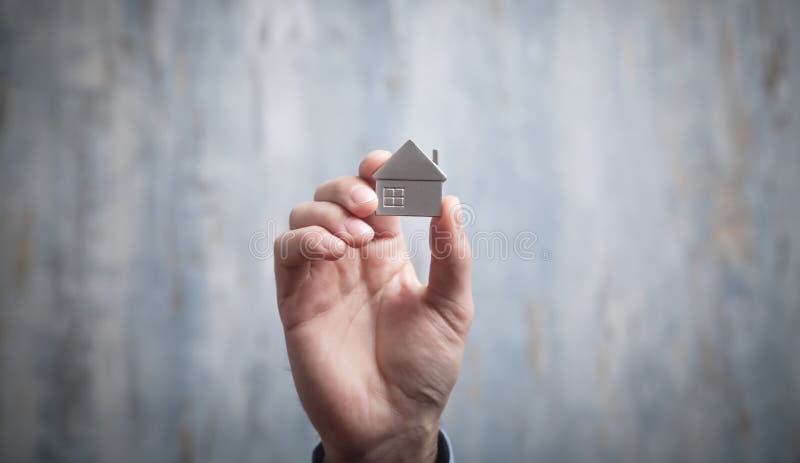 Male Hand Holding Metal House Model Stock Photo - Image of person ...