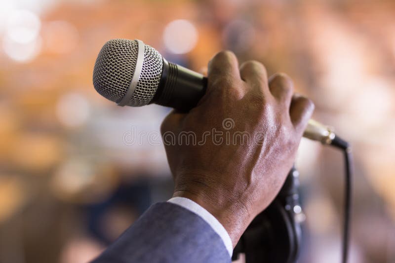 Male Hand Holding Microphone at Conference Hall Stock Photo - Image of ...