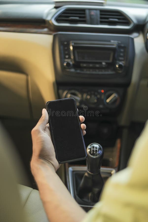 Male Hand Holding Mobile Phone in Car Stock Photo - Image of business ... Male Hand Holding Mobile Phone in Car Stock Photo - Image of business ...