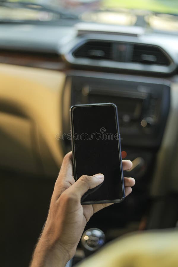 Male Hand Holding Mobile Phone in Car Stock Image - Image of device ... Male Hand Holding Mobile Phone in Car Stock Image - Image of device ...