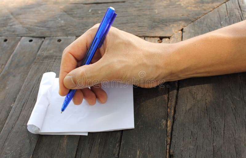 Male hand holding pen stock photo. Image of white, written - 18736678