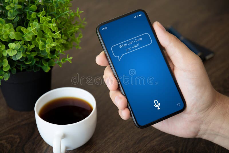 Male Hand Holding Phone with App Personal Assistant on Screen Stock ...
