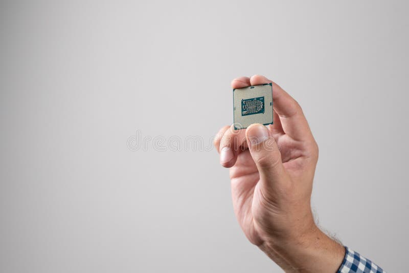 Male Hand Holding a Processor Stock Photo - Image of maintenance, hand ...