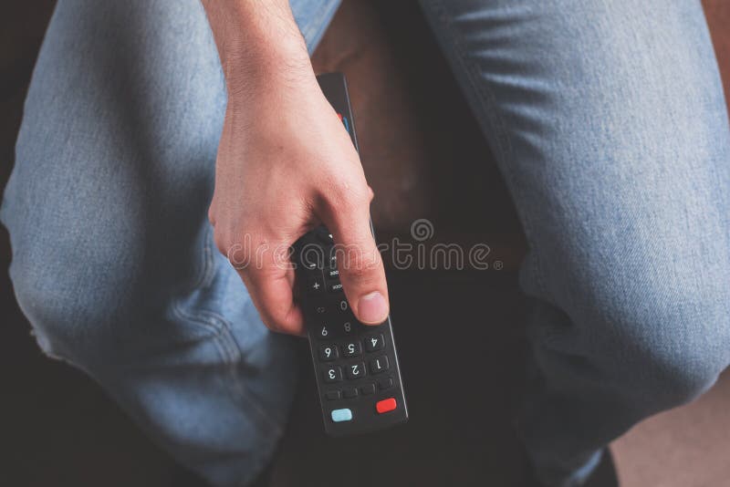 Male Hand Holding Remote Control Stock Image - Image of remote, switch ...