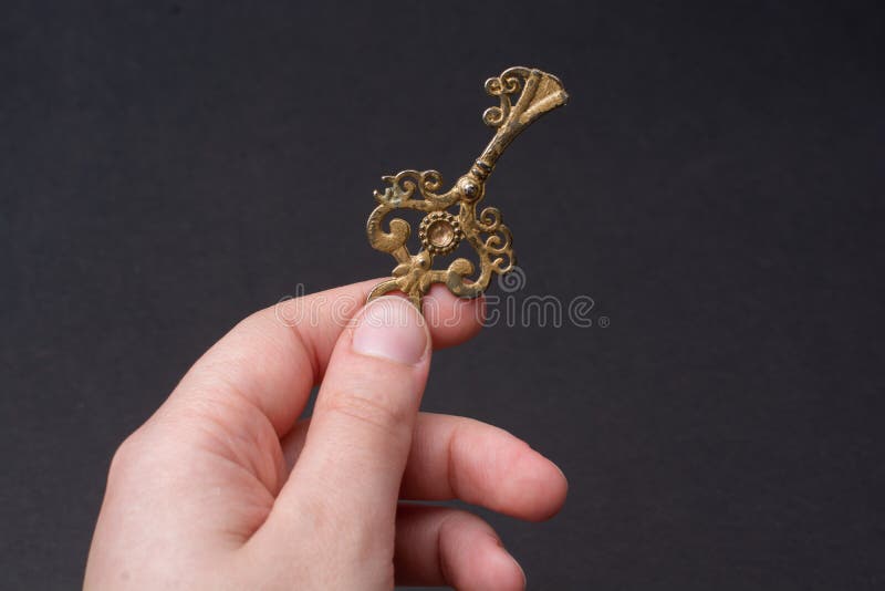 Male Hand Holding a Retro Key Stock Photo - Image of vintage, design ...