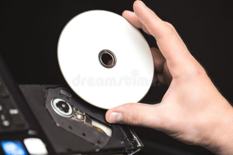 Inserting a disk stock image. Image of hand, insert, electronics - 22521835