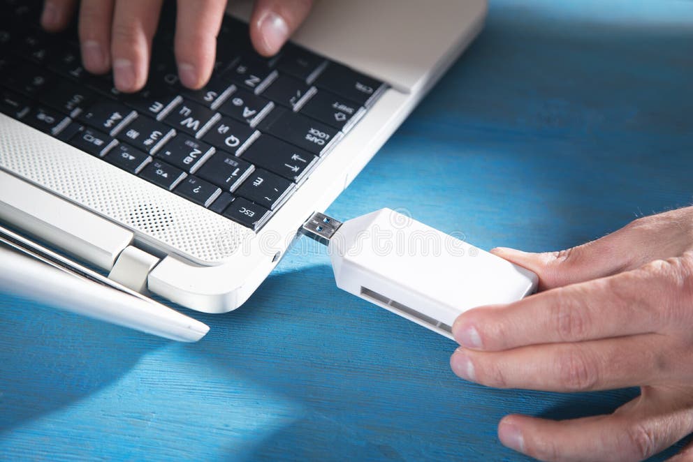 Male Hand Inserting USB Flash Drive into Laptop Computer Stock Photo ...
