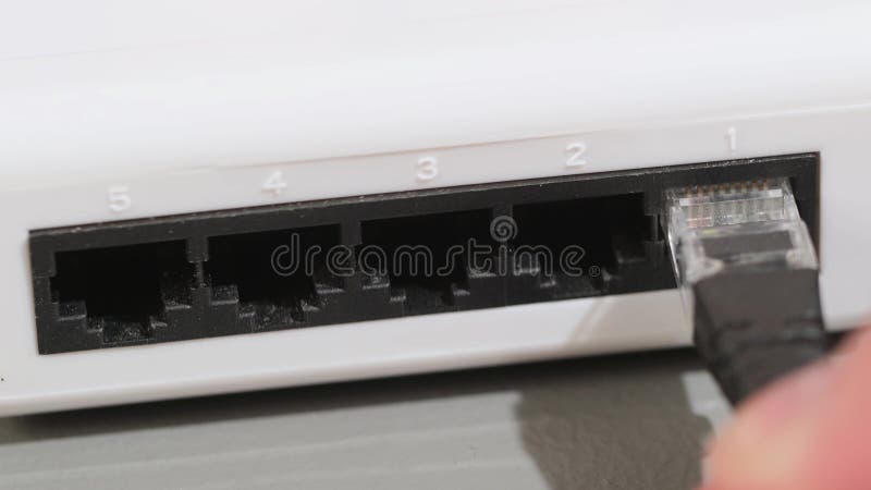Male Hand Inserts the Blue Data Lan Cable Rj45 into Network Switch in ...