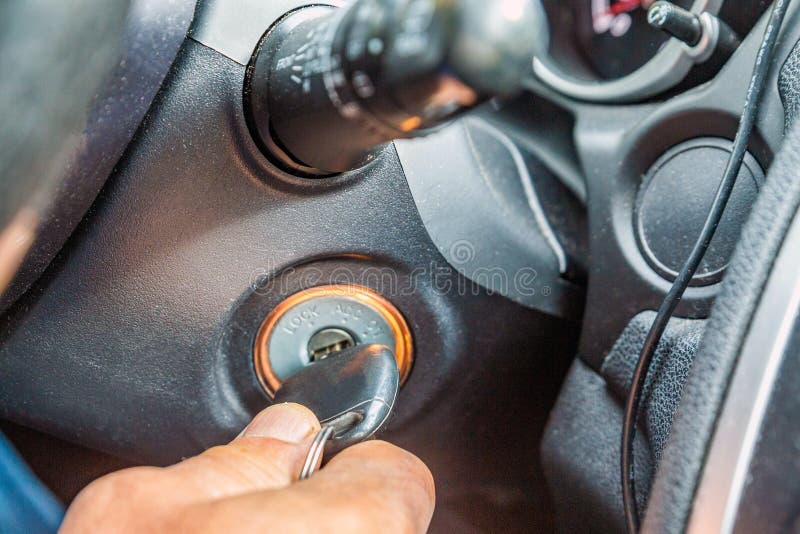 A Male Hand Inserts a Key into the Ignition Switch Stock Image - Image ...