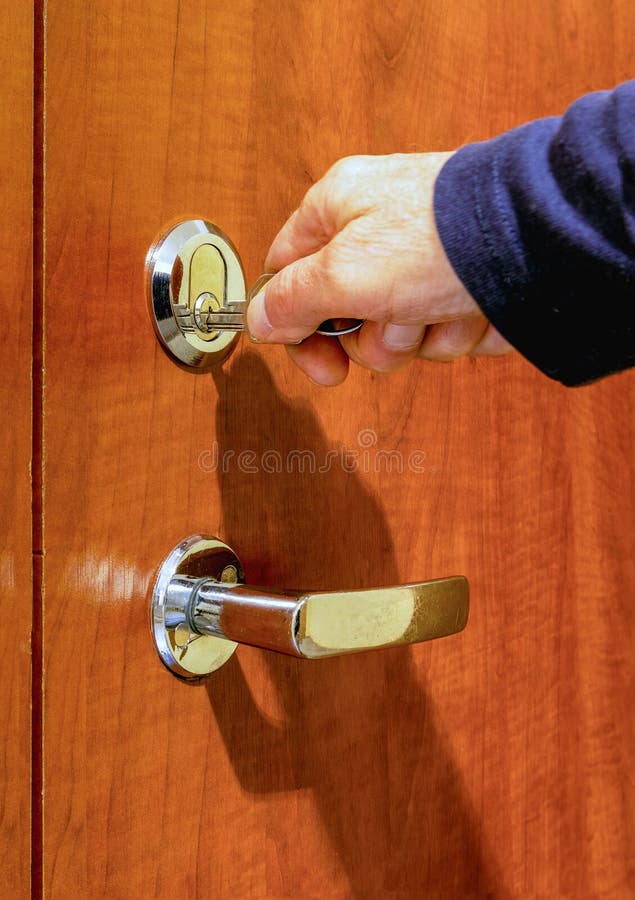 A Male Hand with a Key Locks the Door Stock Photo - Image of real ...