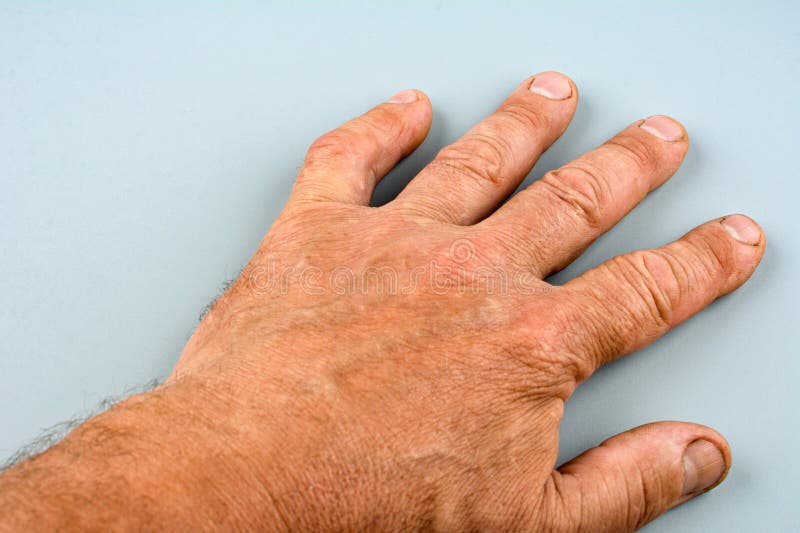 The Male Hand Lies on a Flat Plain Surface Stock Photo - Image of open ...