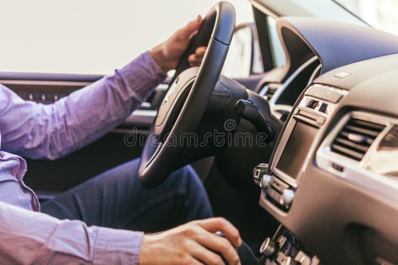 Male hand in a modern car stock image. Image of finger - 70232013