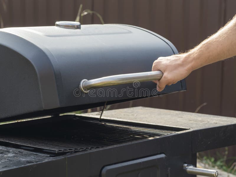 Male Hand Opened the Lid of the Barbecue Grill Stock Image - Image of ...