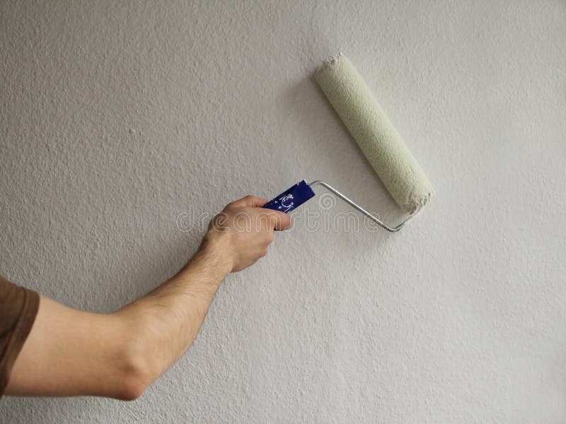 Male Hand is Painting White Paint Roller Stock Image - Image of roller ...