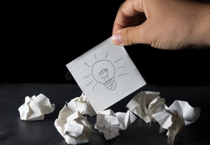 Male hand pick idea paper. stock photo. Image of lamp - 66093948