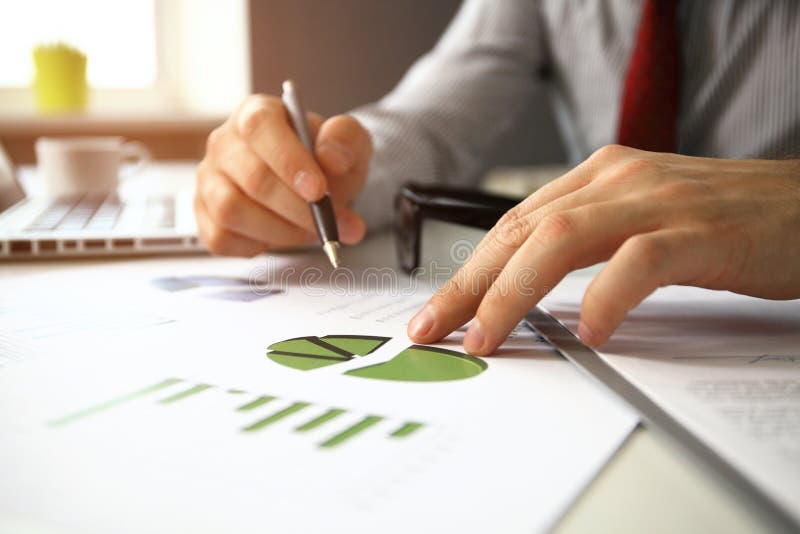 Male Hand Pointing at Business Document during Discussion at Meeting ...