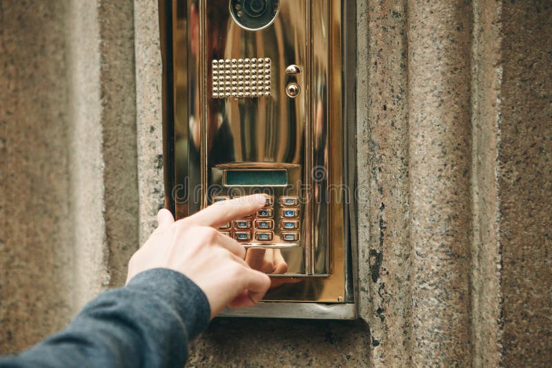 Male Hand Presses A Button On Doorbell And Intercom. Stock Image ...