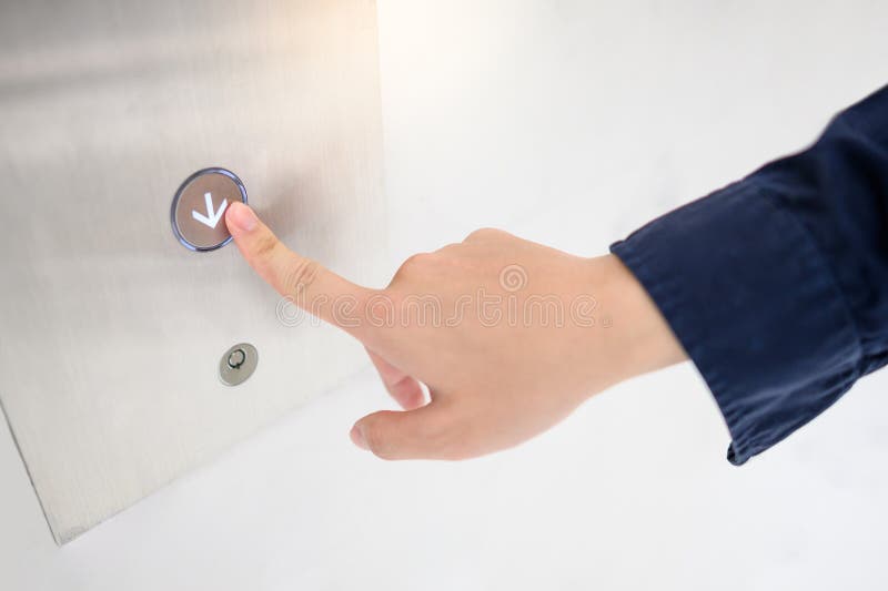 Male Hand Pressing on Down Symbol Button of Elevator Stock Photo ...