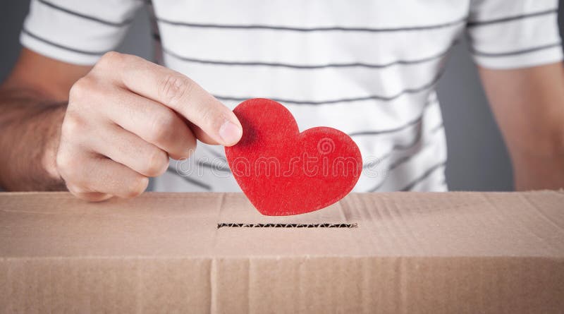 Male Hand Putting Red Heart Box Stock Photos - Free & Royalty-Free ...