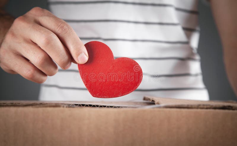 Male Hand Putting Red Heart in Box Stock Photo - Image of help, giving ...