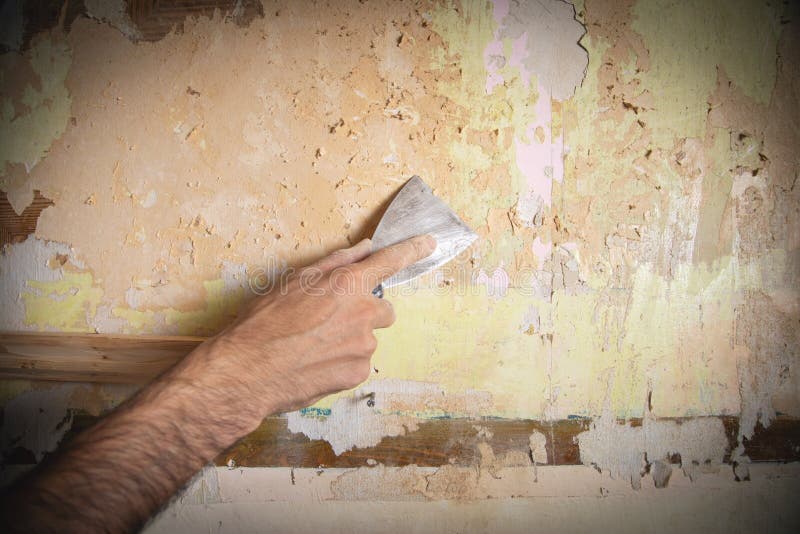 Male Hand Removing Old Wallpaper from the Wall Stock Image - Image of ...