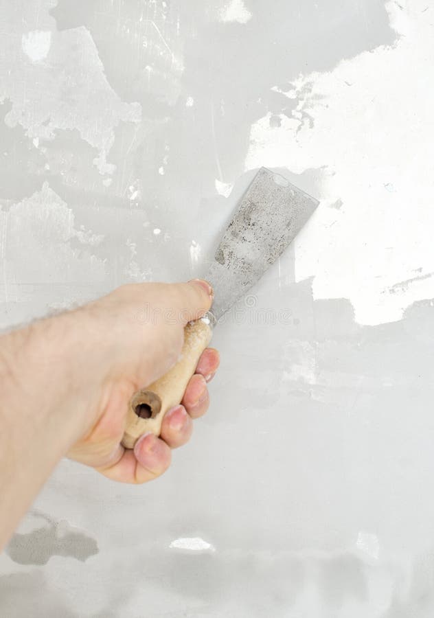 Male hand repairs wall stock photo. Image of putty, home - 36572692