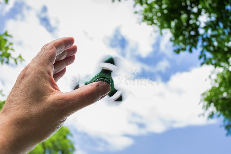 Male Hand With Rotating Fidget Spinner Stock Image - Image of spin ...