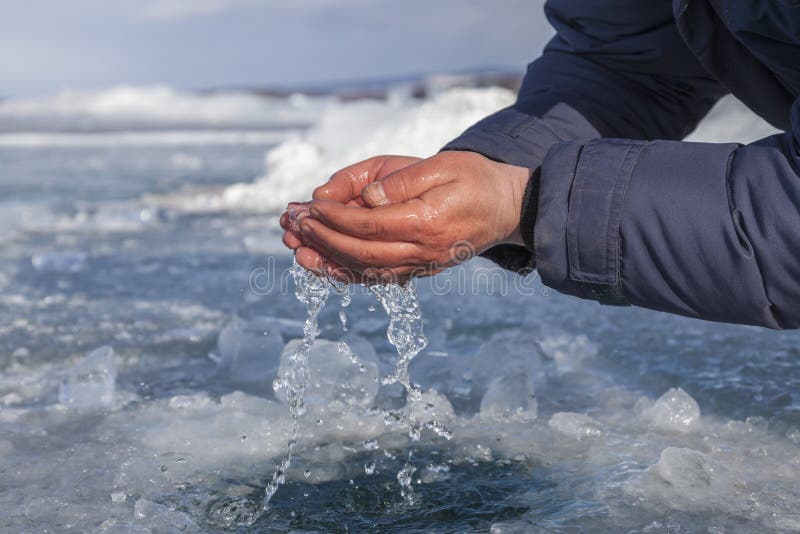 Man Drinking Water from a Hand Hole of Lake Stock Image - Image of hole ...