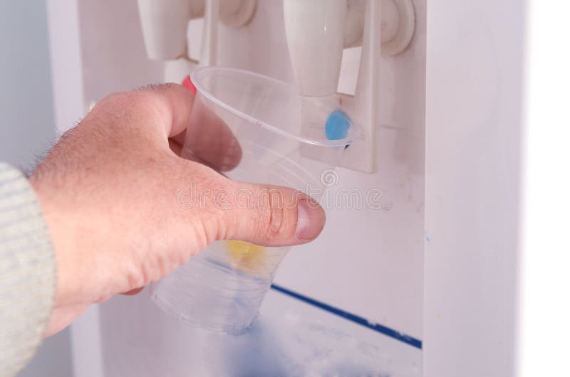 Male Hand Serving Cold Water of a Water Cooler in Plastic Cup Stock ...