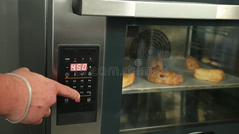 Male Hand Setting Cooking Mode or Temperature on Oven. Finger Press ...
