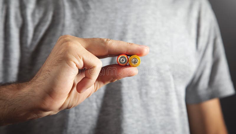 Male Hand Showing Alkaline Batteries Stock Photo - Image of finger ...