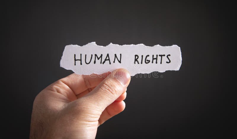 Male Hand Showing Human Rights Text on Torn Paper Stock Image - Image ...