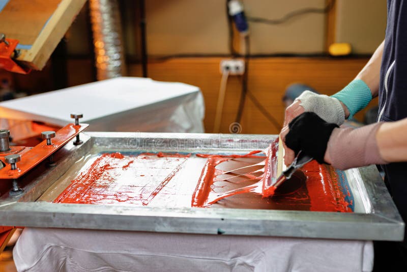 Male Hand with a Squeegee. Serigraphy Production. Printing Images on ...